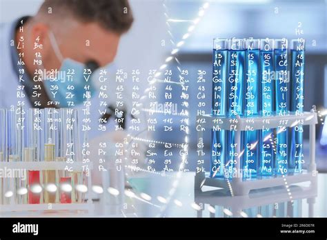 Scientist Working In Laboratory Test Tubes With Reagent And Periodic Table Of Chemical Elements