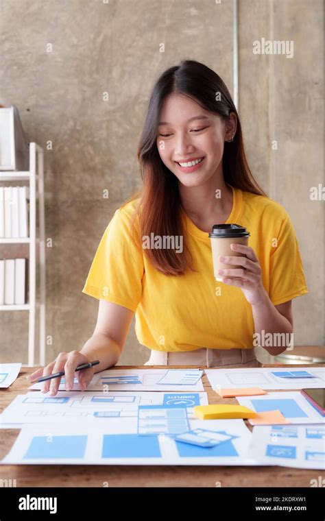 Ux Developer And Ui Designer Brainstorming About App Interface Design At Modern Office Creative