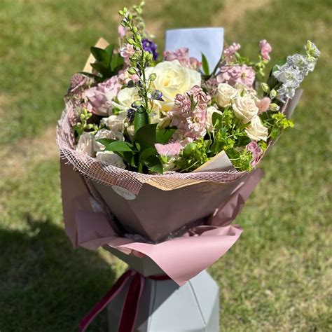 Simply This Stunning Arrangement With A Mix Of Lilac And White Roses