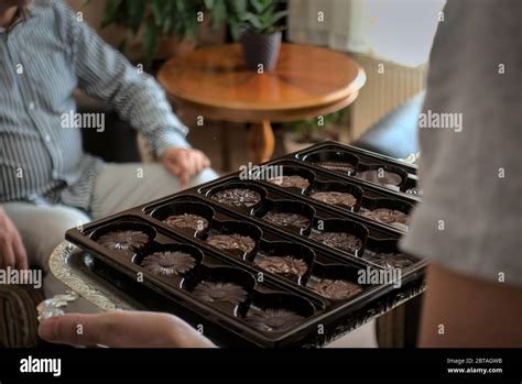 Close Up Turkish Muslim Wife Serving Chocolate To Her Husband To