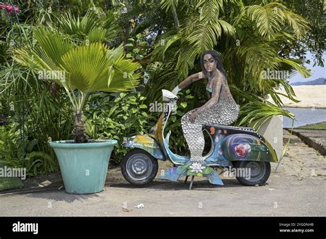 Figure Of The Water Goddess Mami Wata On A Vespa In Front Of The Mami
