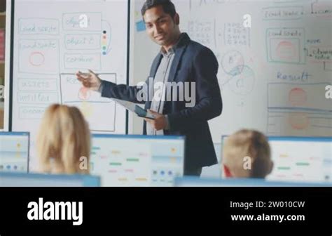 Elementary School Class Teacher Uses Interactive Digital Whiteboard