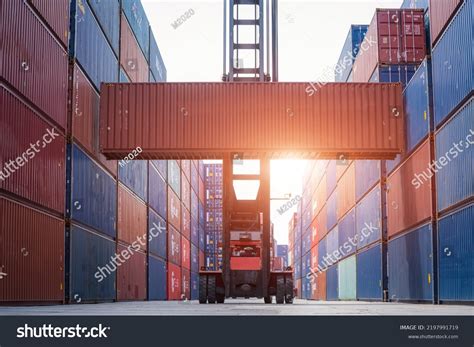 Crane Lifting Container Unloading Cargo Into Stock Photo Shutterstock