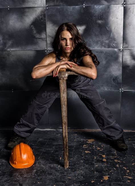 Female Miner Worker With Pickaxe In Coveralls Over His Naked Body Erotic Industry Concept