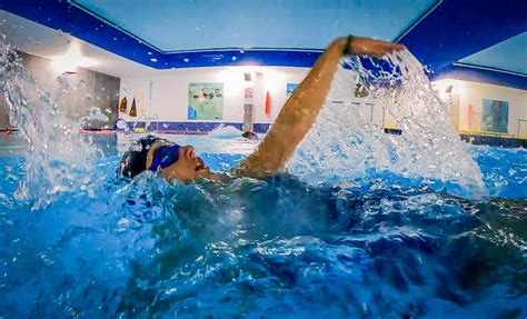 Adults Making Waves Swimming