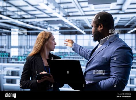 Teamworking Colleagues In Data Center Identifying And Solving Technical