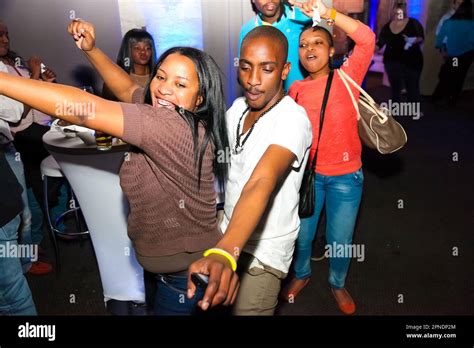 A Young African American Couple Enjoying A Night Out At A Nightclub