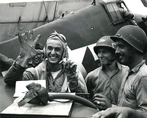 An Elated Fighter Pilot Alexander Vraciu Showing How Many Enemy