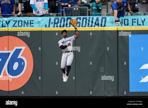 Miami Marlins Center Fielder Jonathan Davis Leaps To Catch A Fly Ball