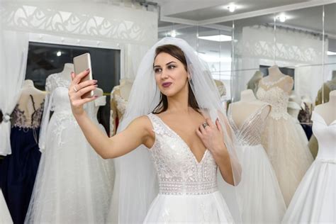 Premium Photo Young Bride Making Selfie In Wedding Dress In Salon