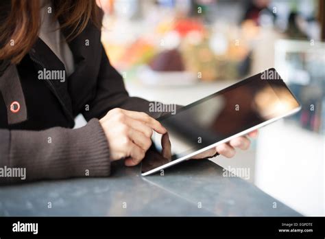 Woman Hands With Digital Tablet Blank Screen In A Public Market Stock Photo Alamy