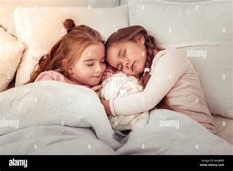 Cute Sister Love Portrait Of Two Cute Little Sisters At Home On