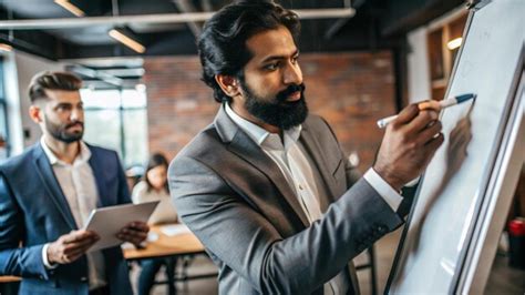 Indian Business Writing On Whiteboard In Office Premium AI Generated Image