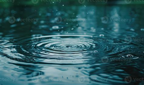 Raindrops Falling On The Surface Of A Serene Lake Ripples On Water