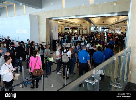 Passengers Standing In Line Queue At Terminal 2 Waiting To Pass