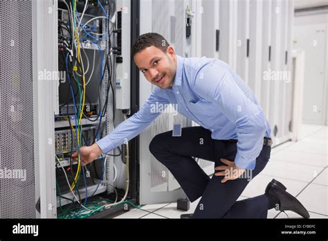 Technician Plugging Cable Into Server Stock Photo Alamy
