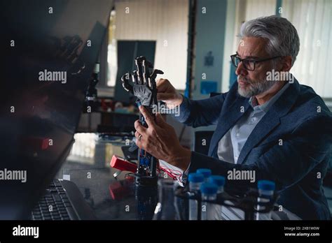 Robotics Engineer Adjusting Calibring Robotic Prosthetic Hand Concept Of Modern Technology In