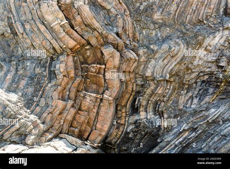 Folded And Fractured Sedimentary Rocks On A Cliff Facing The Atlantic