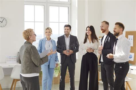 Team Brainstorming Session In A Modern Office Space During Daylight Hours Stock Image Image Of