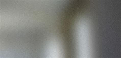 Premium Photo Light Reflecting On Grainy Textured Surface Creating An Abstract Background