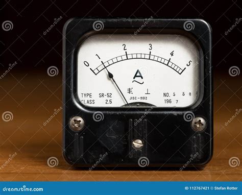 An Old Black Analog Ampere Meter On A Wooden Table Stock Image Image