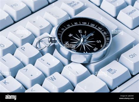 The Internet Navigator Concept Old Metallic Compass On The Computer