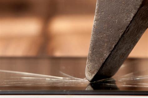 Premium Photo Smashed Screen Vandalised Broken Glass Close Up With Hammer