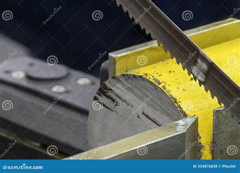 The Band Saw Cutting Machine Cutting The Metal Shaft Parts With Coolant