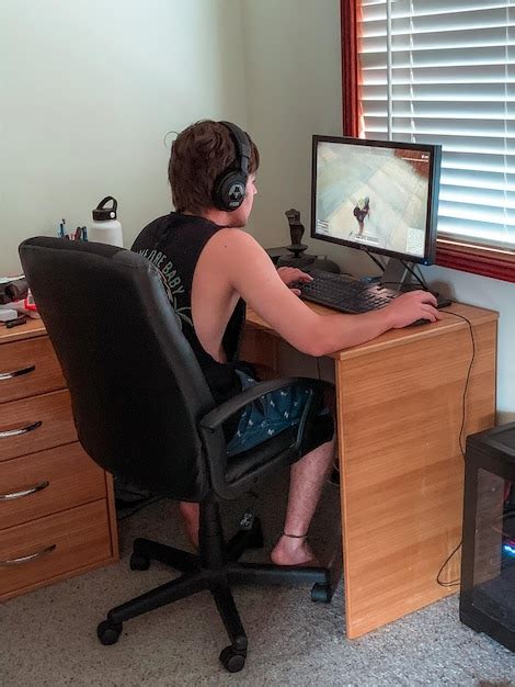 Premium Photo Full Length Of Man Playing Video Game On Computer
