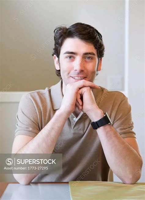 Man Sitting At Table SuperStock