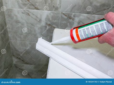 Man Is Putting Glue On Gypsum Baseboard Maintenance Repair Works