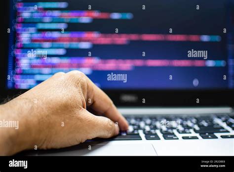 The Programmers Hand Is Writing The Source Code Programmers Write