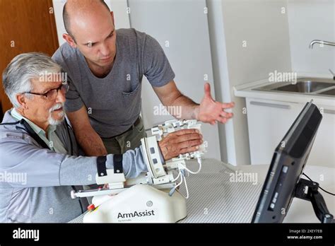 Patient With Assistive Robot For Upper Limb Rehabilitation The Robot Armassist Allows Passive