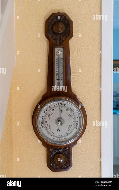 British Made Antique Aneroid Barometer With A Face Showing Stormy Rain