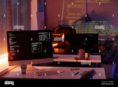 Computer Monitor With Coded Data On Screen Standing On Workplace Of Contemporary Diversity