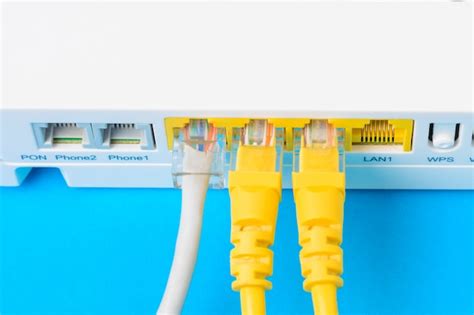 Premium Photo Internet Modem Router Hub With A Cable Connecting On Blue Background