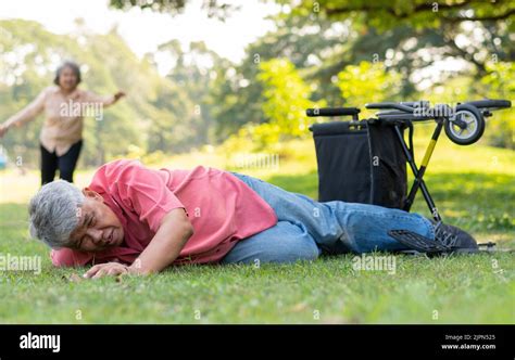 Asian Senior Man Falling Down From Wheelchair On Lying Floor After