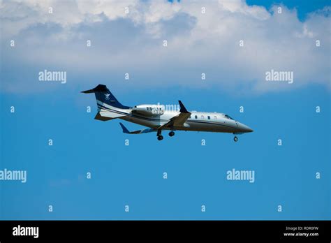 Small Private Jet Airplane Preparing For Landing At Day Time In