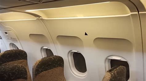 What Are The Triangle Symbols Above Airplane Windows For