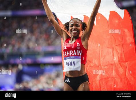 Winfred Yavi Celebrating Her Medal With Her Countrys Flag At The Paris 2024 Olympic Games Stock