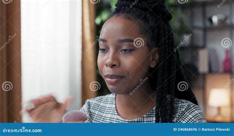 Close Up From Behind Ring Light On Face Of Dark Skinned Woman Of