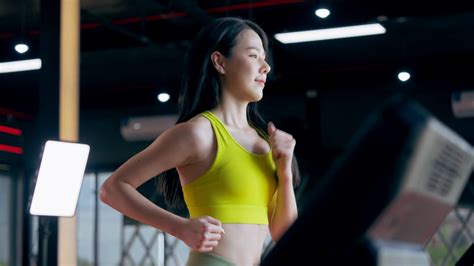 Babe Asian Woman Running On Treadmill Stock Footage SBV Storyblocks