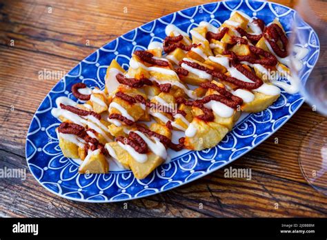Baked In Oven Spanish Tapas Potatoes Bravas Baked With Tomato Sauce Stock Photo Alamy