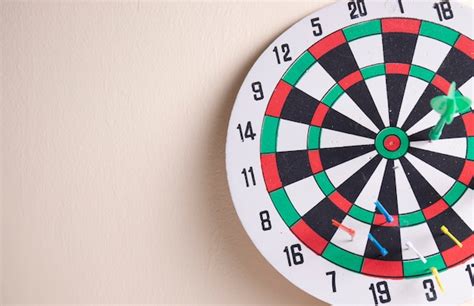Premium Photo Dart Borad Hang On The Wall And Red Dart
