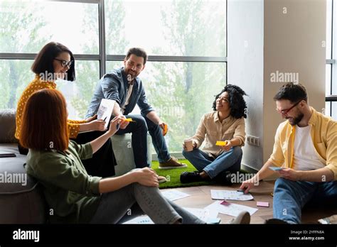 Diverse Team Of Designers Is Having A Productive Brainstorming Session