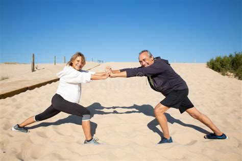 Portrait Of Aged Couple Demonstrating Flexibility For Camera Stock Photo Image Of Portrait