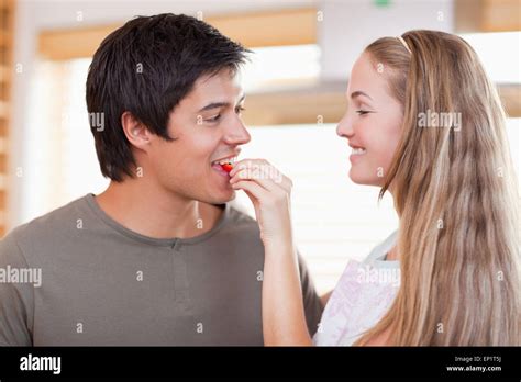 Woman Feeding Her Fiance Stock Photo Alamy
