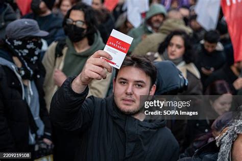 A Protester Shows The Constitution Booklet Of The Republic Of Türkiye