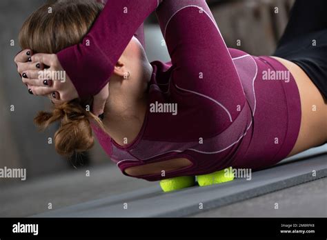 A Woman Massages The Trigger Point Of Her Back With Balls The Concept Of Myofascial Release
