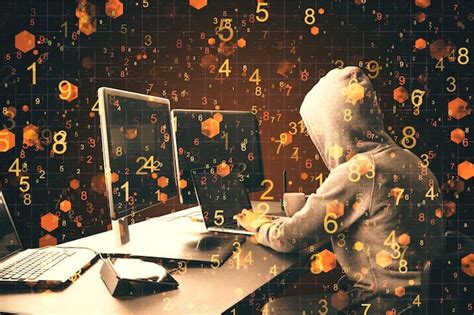premium photo hacker at desktop using laptop with abstract digital
